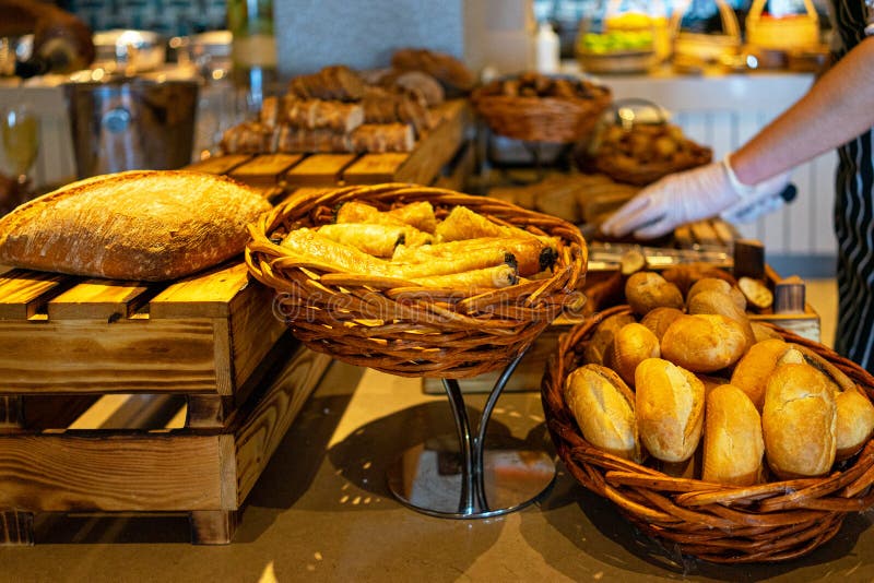 A Cutting Board with Bread on Self Service Table Breakfast Buffet in ...
