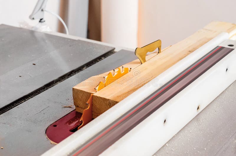 Cutting the Board on a Circular Saw in a Woodworking Workshop Stock ...