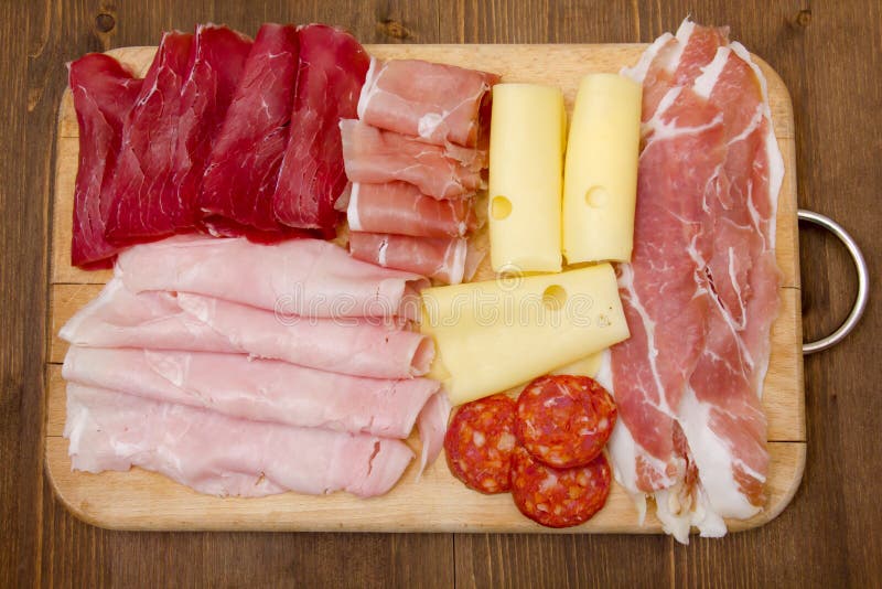 A Board of Cold Cuts As an Appetizer - Raw Dried Ham and Cooked Ham ...