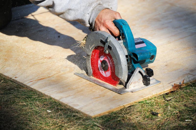 Cutting the Board with Electric Circular Saw Stock Photo - Image of ...