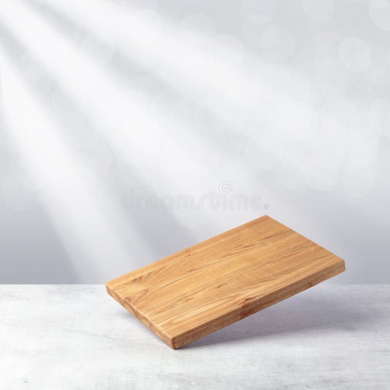 Cutting Board Falling on a Grey Stone Table Stock Image - Image of ...