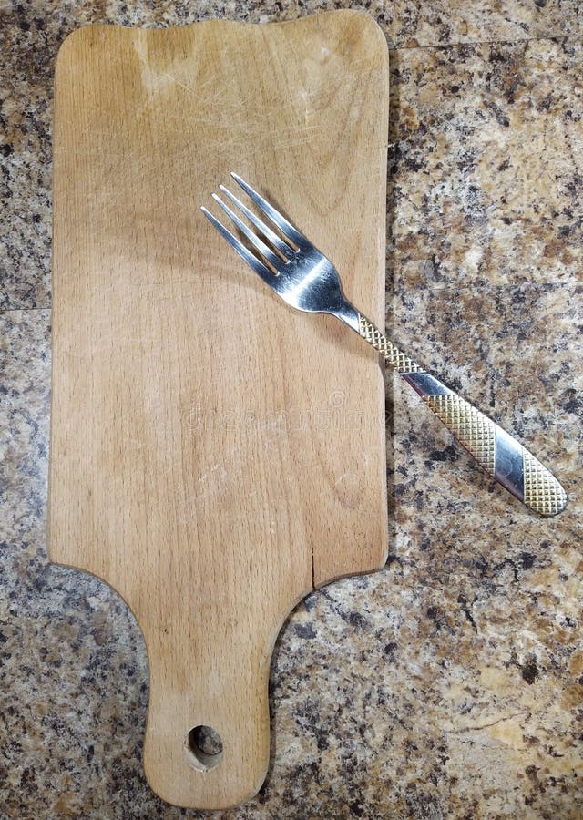 Cutting Board with Fork on Kitchen Table Stock Photo - Image of wood ...