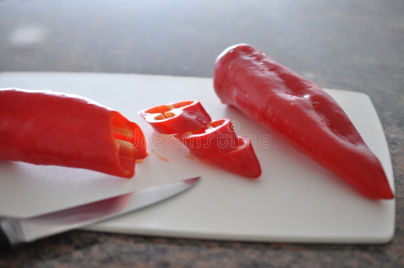 Red Paprikas on Cutting Board Stock Image - Image of fruit, breakfast ...