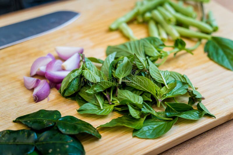 Cutting Board with Ingredients for Preparing Green Curry with Herbs and ...