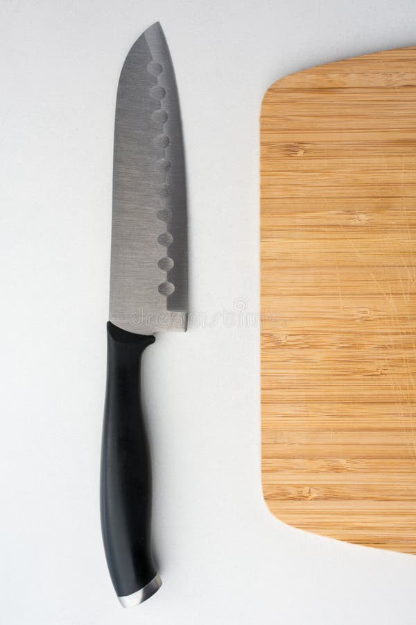 Cutting Board with Knife on White Counter Stock Photo - Image of ...