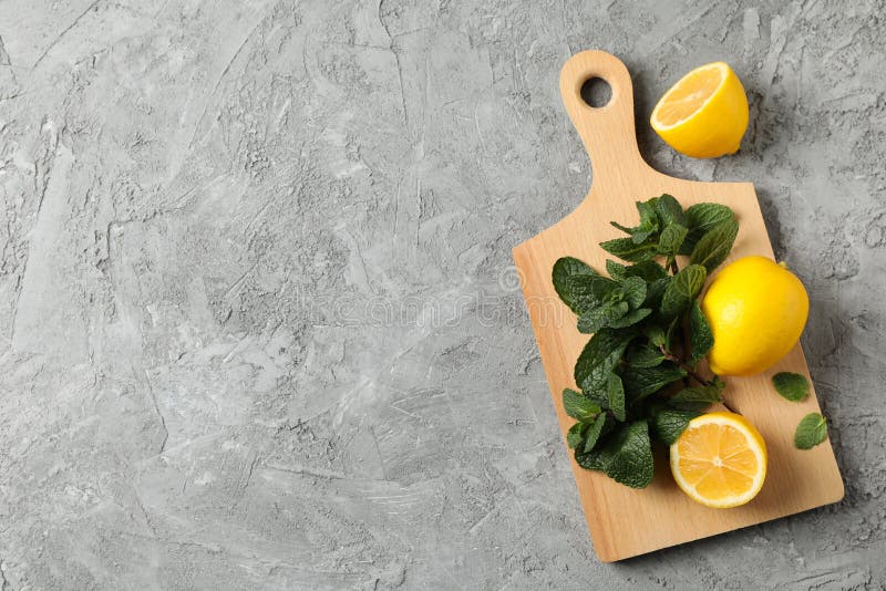 Cutting Board with Lemon and Mint on Grey Background Stock Image ...