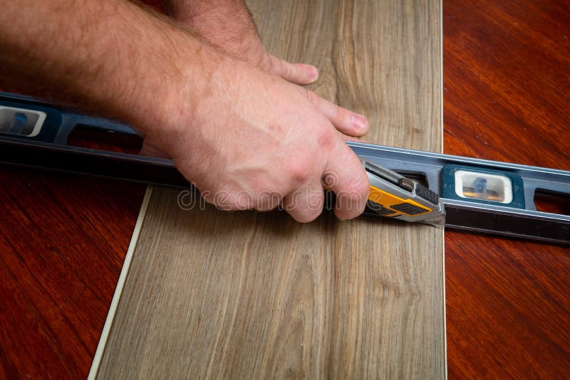 Cutting the Board Under the Ruler Stock Photo - Image of kneel, cutter ...
