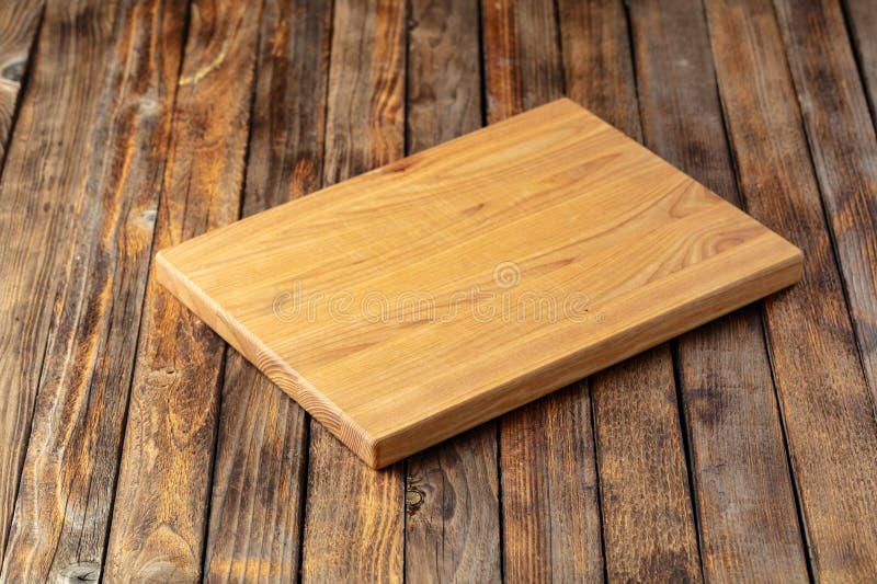 Cutting Board on a Wooden Table Stock Photo - Image of wooden, kitchen ...