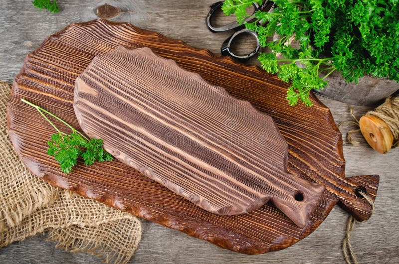Cutting Boards on Wooden Kitchen Table Stock Photo - Image of ...