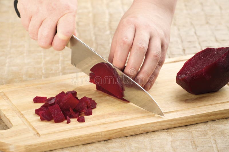 Cutting the boiled beets stock photo. Image of cutting - 51157316