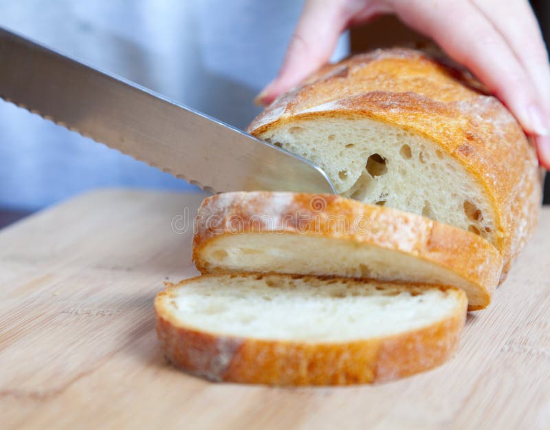 Cutting bread stock image. Image of knife, board, diet - 21600895