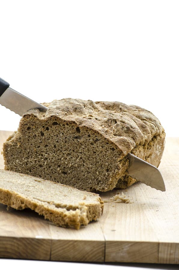 Cutting a bread stock photo. Image of crust, slice, grain - 27767484