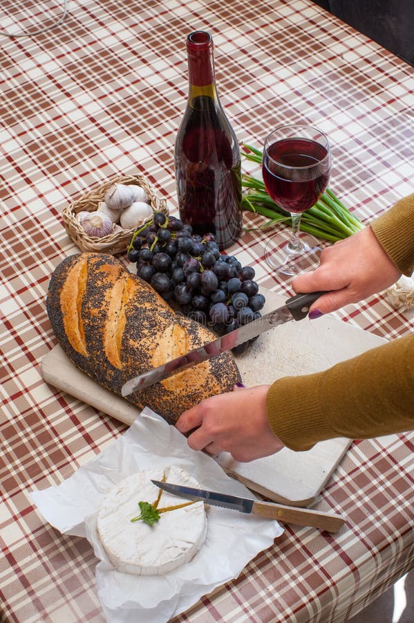 Cutting Bread for for Cheese and Wine Stock Image - Image of french ...