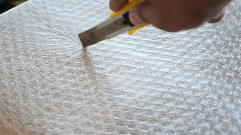 Cutting Bubble Wrap for Packaging Materials Stock Footage - Video of ...