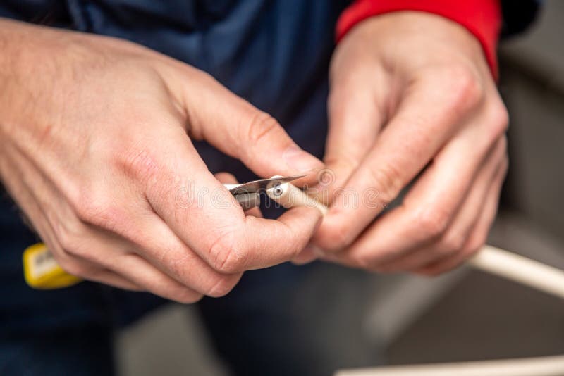 Cutting Cable Insulation with a Segmented Knife. White Cable, Yellow ...