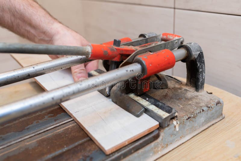 Cutting Ceramic Tiles with a Special Hand Machine with a Sharp Diamond ...