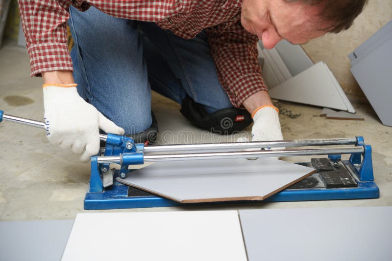 Cutting Ceramic Tiles with a Special Hand Machine with a Sharp Diamond ...
