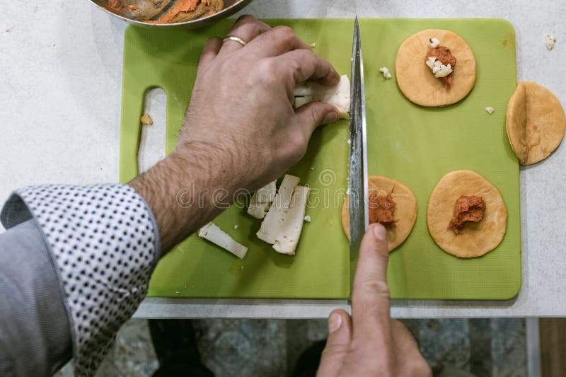 Cutting Cheese on a Cutting Board in a Restaurant Kitchen Preparing ...