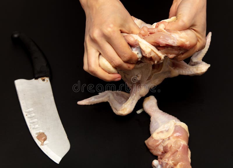 Cutting Chicken Carcass on a Black Background Stock Image - Image of ...