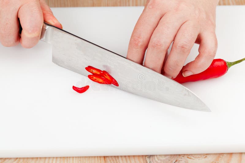 Cutting chili peppers stock photo. Image of pepper, spicy - 51157270