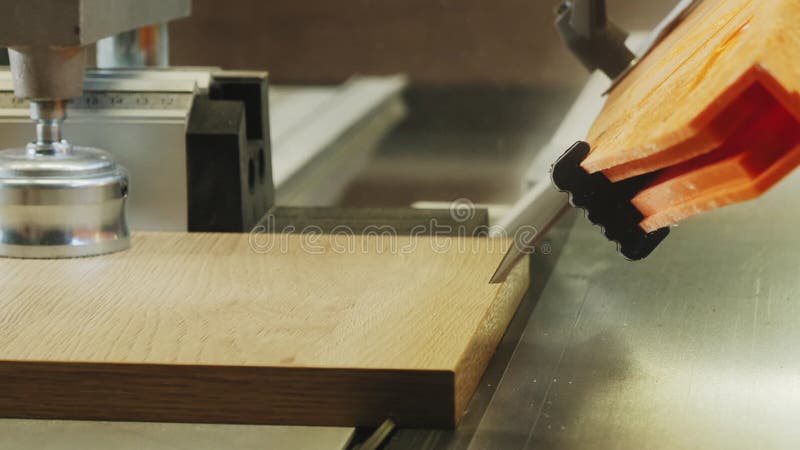 Cutting Chipboard at 45 Degrees on Professional Equipment. Close-up ...