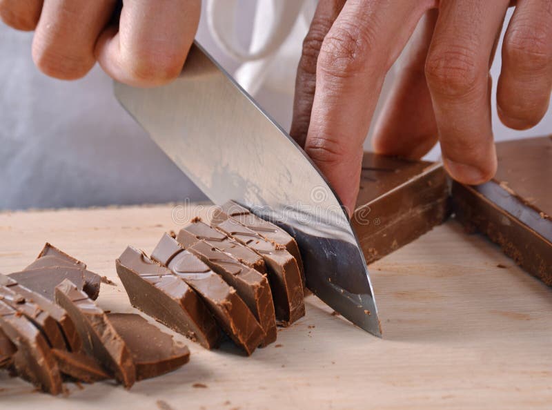 Cutting a Chocolate Cake Decorated with Roses Stock Photo - Image of ...