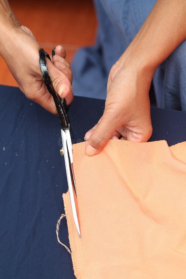 Fashion Designer Cutting Fabric In Studio. Tailor Hands Working With ...