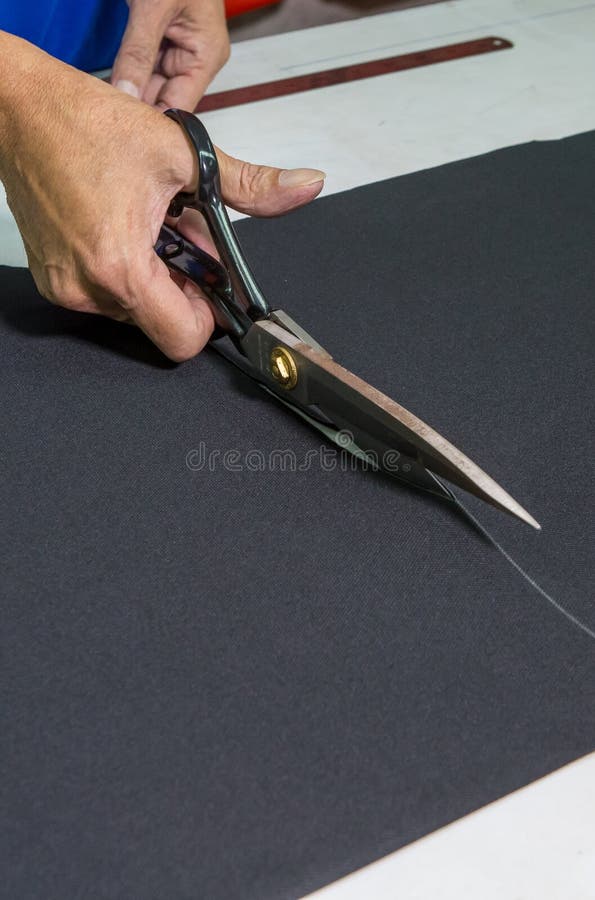 Cutting the Cloth by Using the Tailor Scissors Stock Image - Image of ...