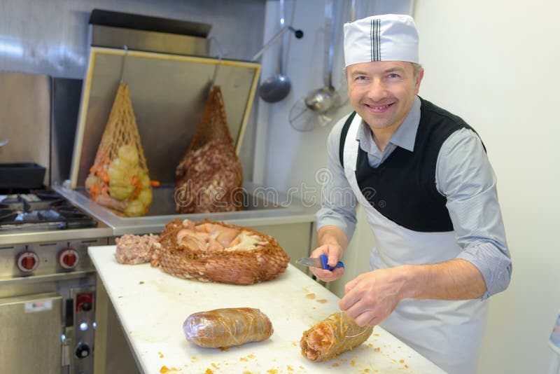 Cutting a cooked meat stock image. Image of health, establishment ...