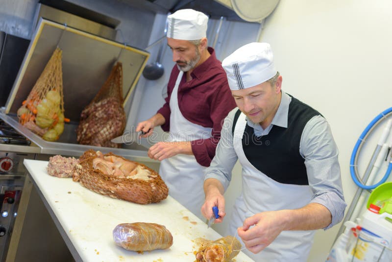Cutting the cooked meat stock image. Image of consumption - 124173967
