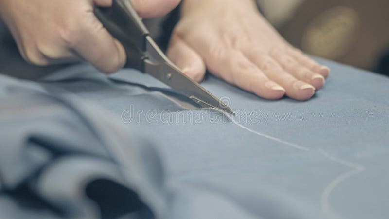 Cutting the Fabric with Sharp Scissors. Cut the Fabric with Tailor`s ...
