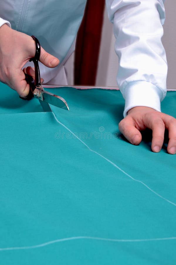 Cutting a fabric. stock photo. Image of tailor, profession - 38720024