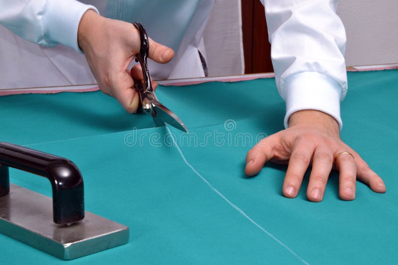 Cutting a fabric. stock photo. Image of sewing, fashion - 38720296