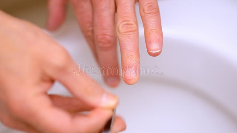 Cutting Fingernails with Nail Clipper, Manicure at Home Stock Image ...