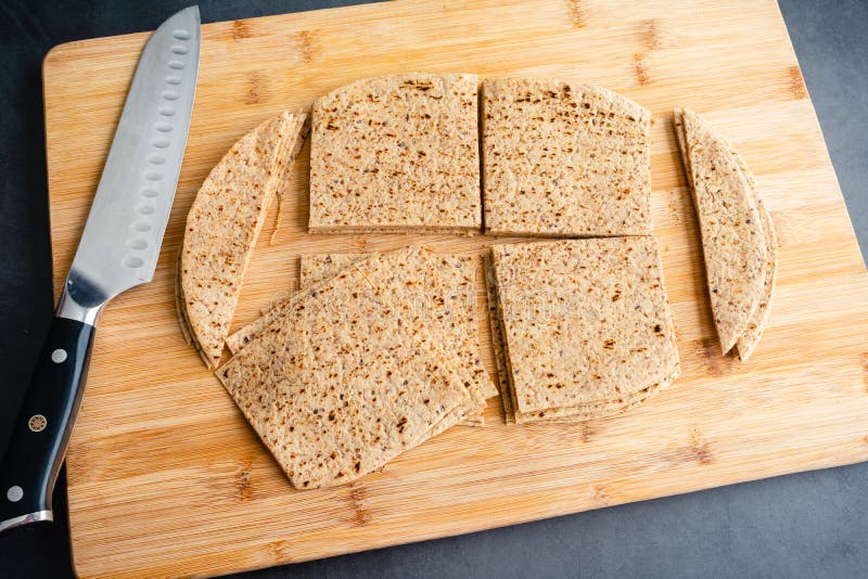 Cutting Whole Grain Flatbreads into Squares Stock Photo - Image of ...