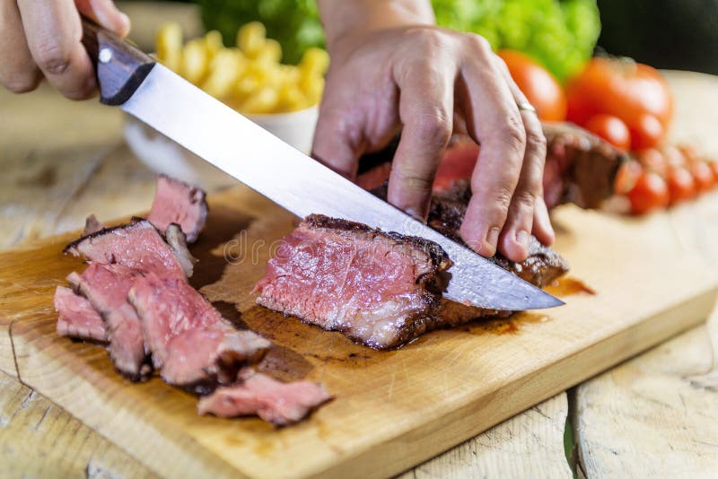 Beef Steak Cut on Chopping Board Stock Photo - Image of rare ...