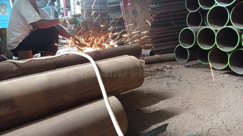 Cutting Iron Pipes Using Bench Grinder Stock Photos - Free & Royalty ...