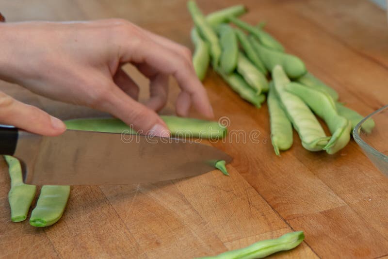 Cutting Large Green Snap Peas Stock Photo - Image of food, knife: 156402490