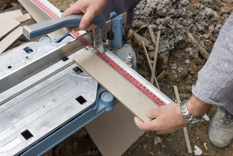 Cutting a Large Tile with Cutting Tool Stock Photo - Image of ...
