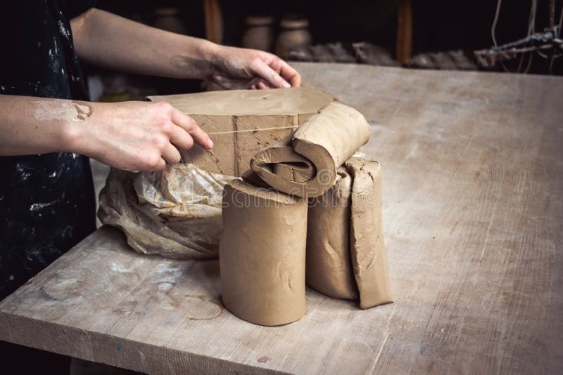 Cutting Layers of Clay Pieces for Sculpting in the Potter`s Workshop ...