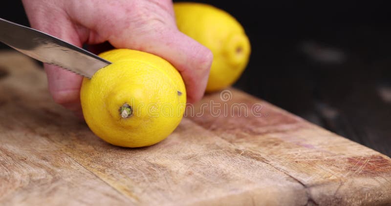 Cutting a Lemon into Pieces during Cooking Stock Footage - Video of ...