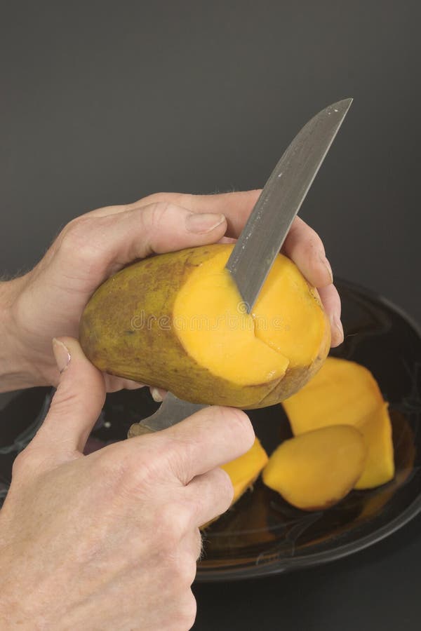 Cutting a Mango 1 stock photo. Image of sweet, culinary - 970738
