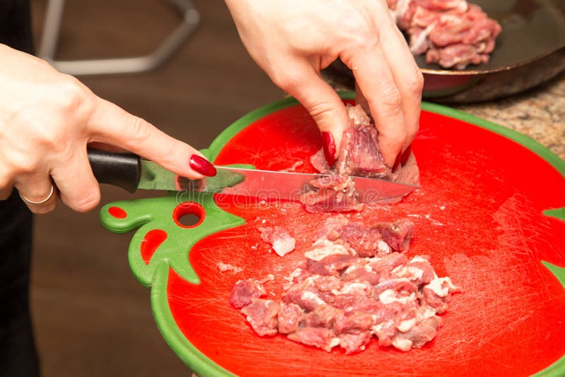 Cutting Meat with a Knife on the Board Stock Image - Image of kitchen ...
