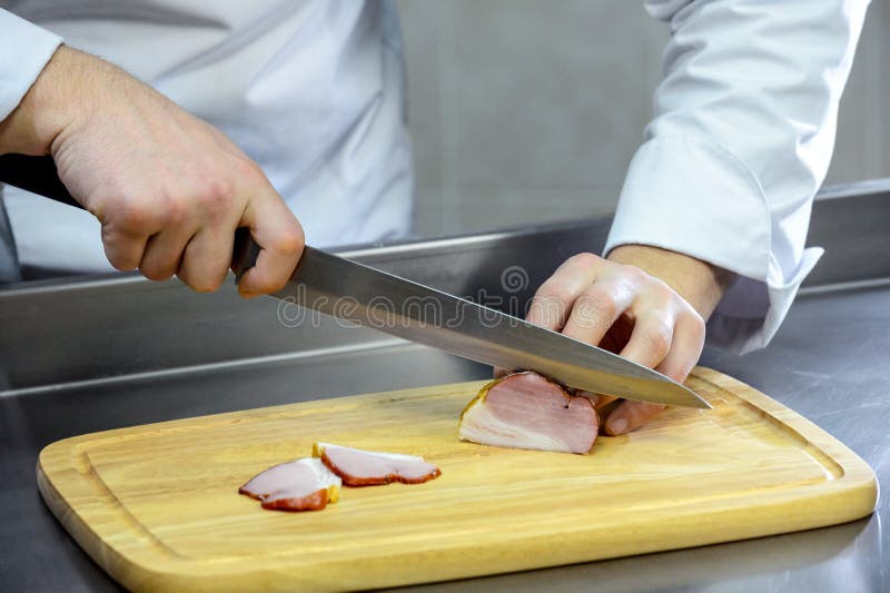 Cutting Meat with a Knife on a Wooden Board Stock Photo - Image of chef ...