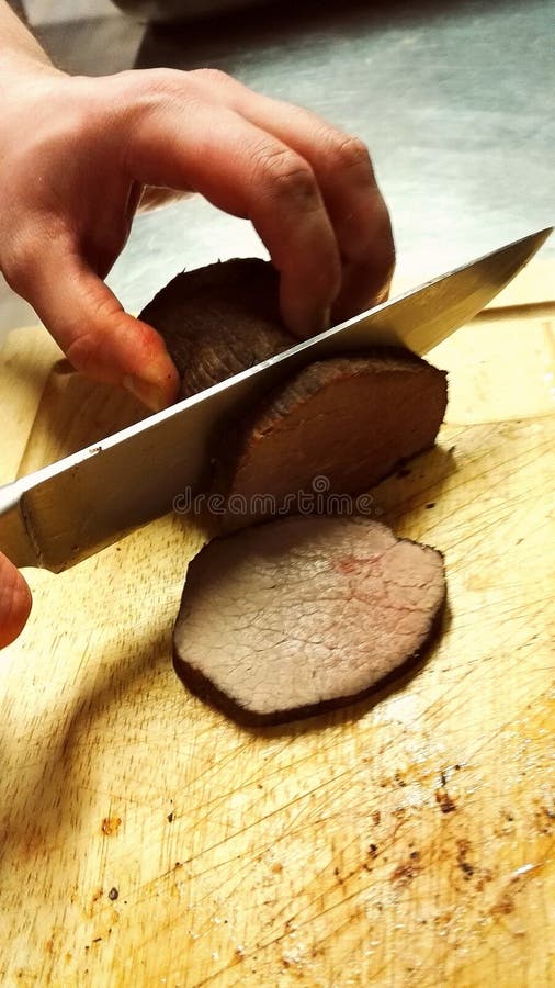 Cutting meat for serving stock photo. Image of eating - 94368120
