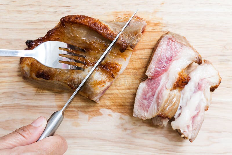 Cutting medium rare pork stock photo. Image of objects - 82264880