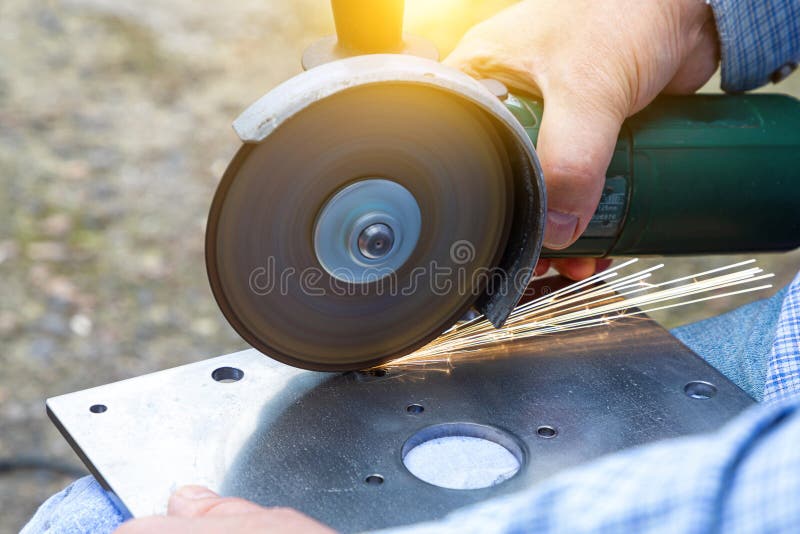 Cutting Metal with a Grinder. Processing and Grinding of Metal with ...
