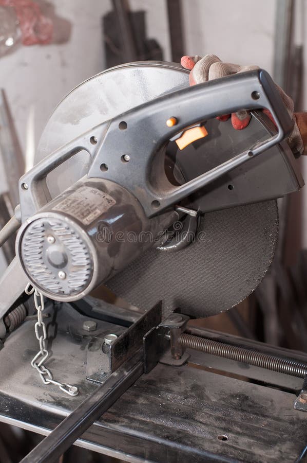 Cutting Metal with Grinder in Workshop. Sparks while Grinding Iron ...
