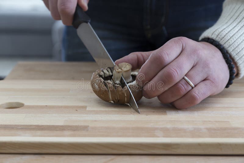 Cutting the mushroom stock photo. Image of kitchen, mushroom - 68064652
