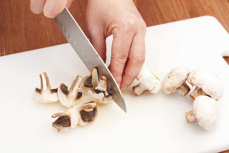 Cutting mushrooms stock photo. Image of edible, wooden - 49106976
